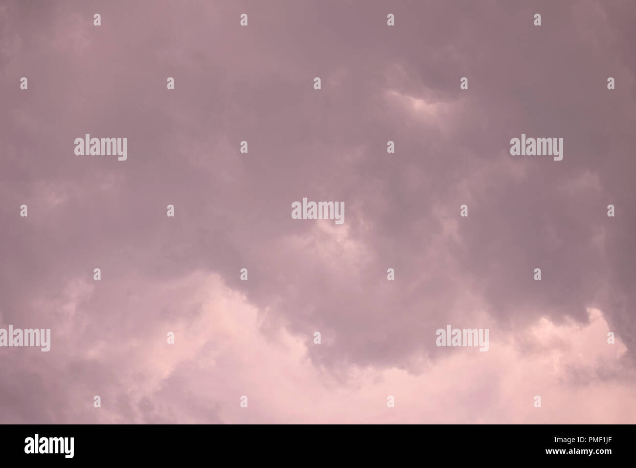 Nature background. Fluffy soft clouds in sky toned Stock Photo - Alamy