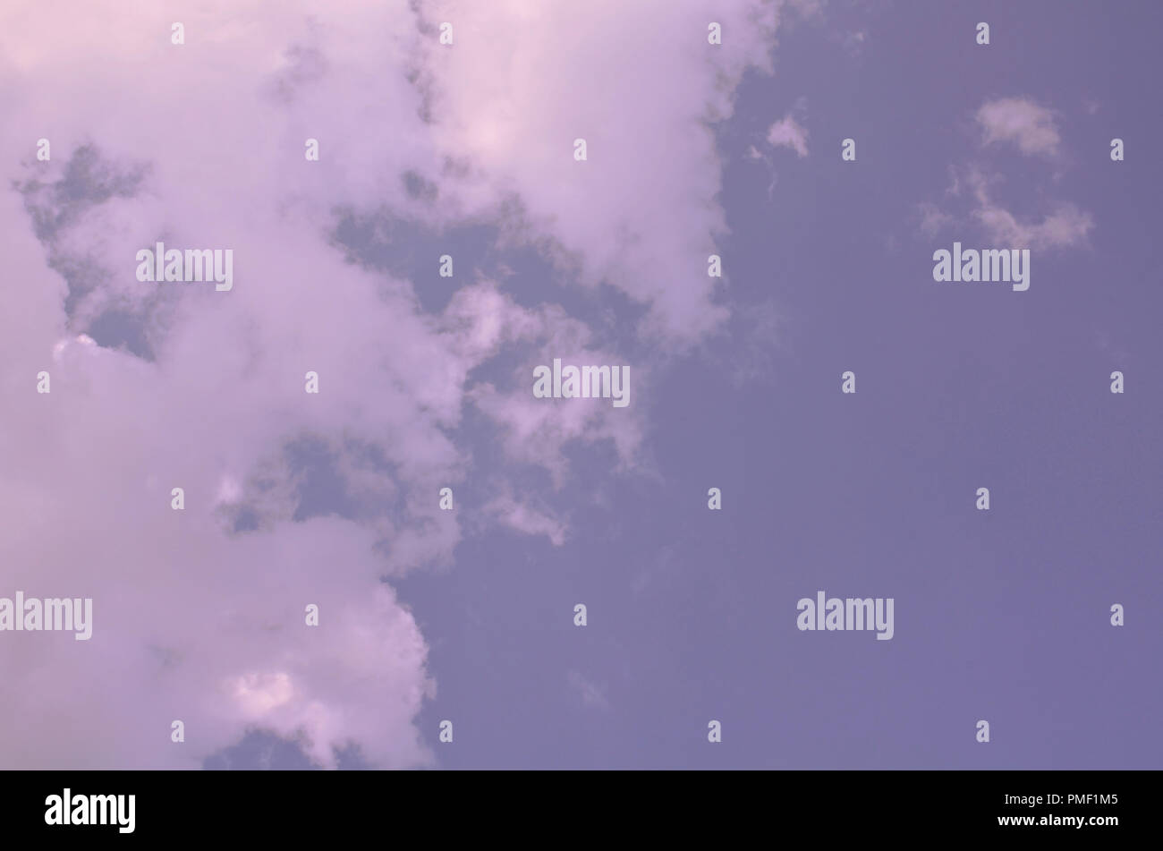 Nature background. Fluffy soft clouds in sky toned Stock Photo - Alamy