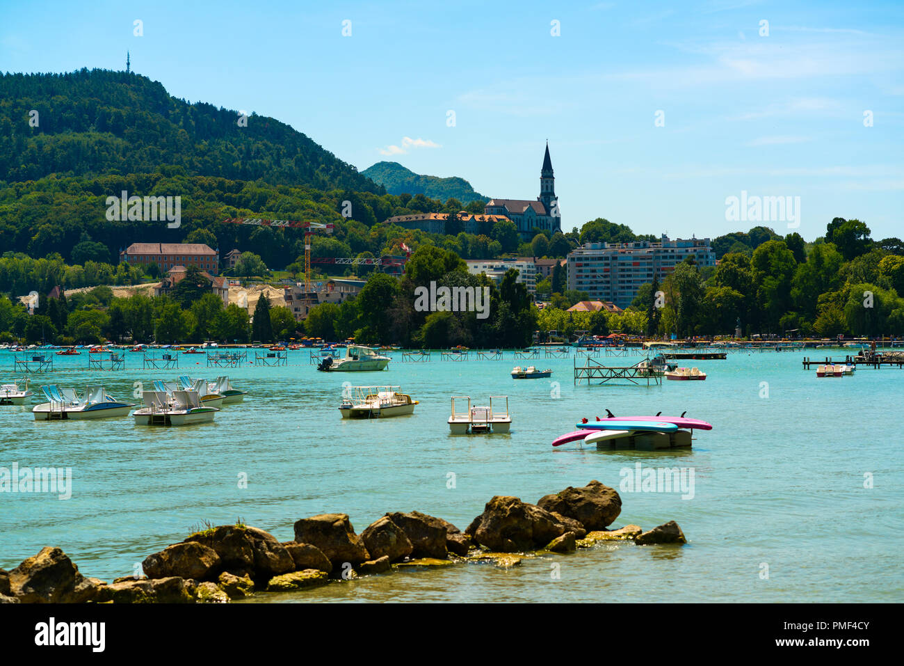 Annecy lake view with town in background with church tower Stock Photo ...
