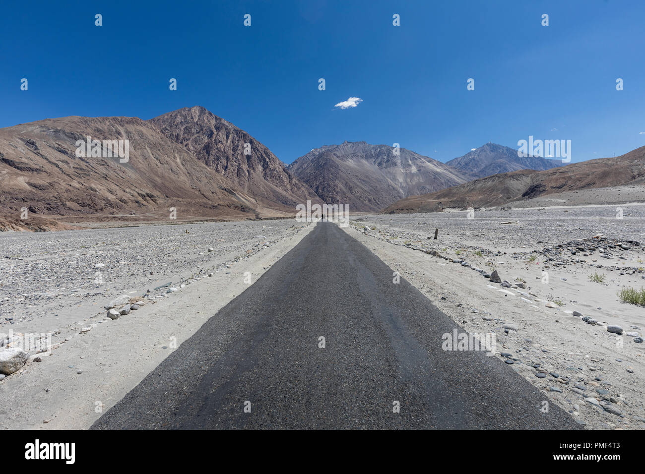 View of a road through the barren rocky landscape in the Ladakh region ...