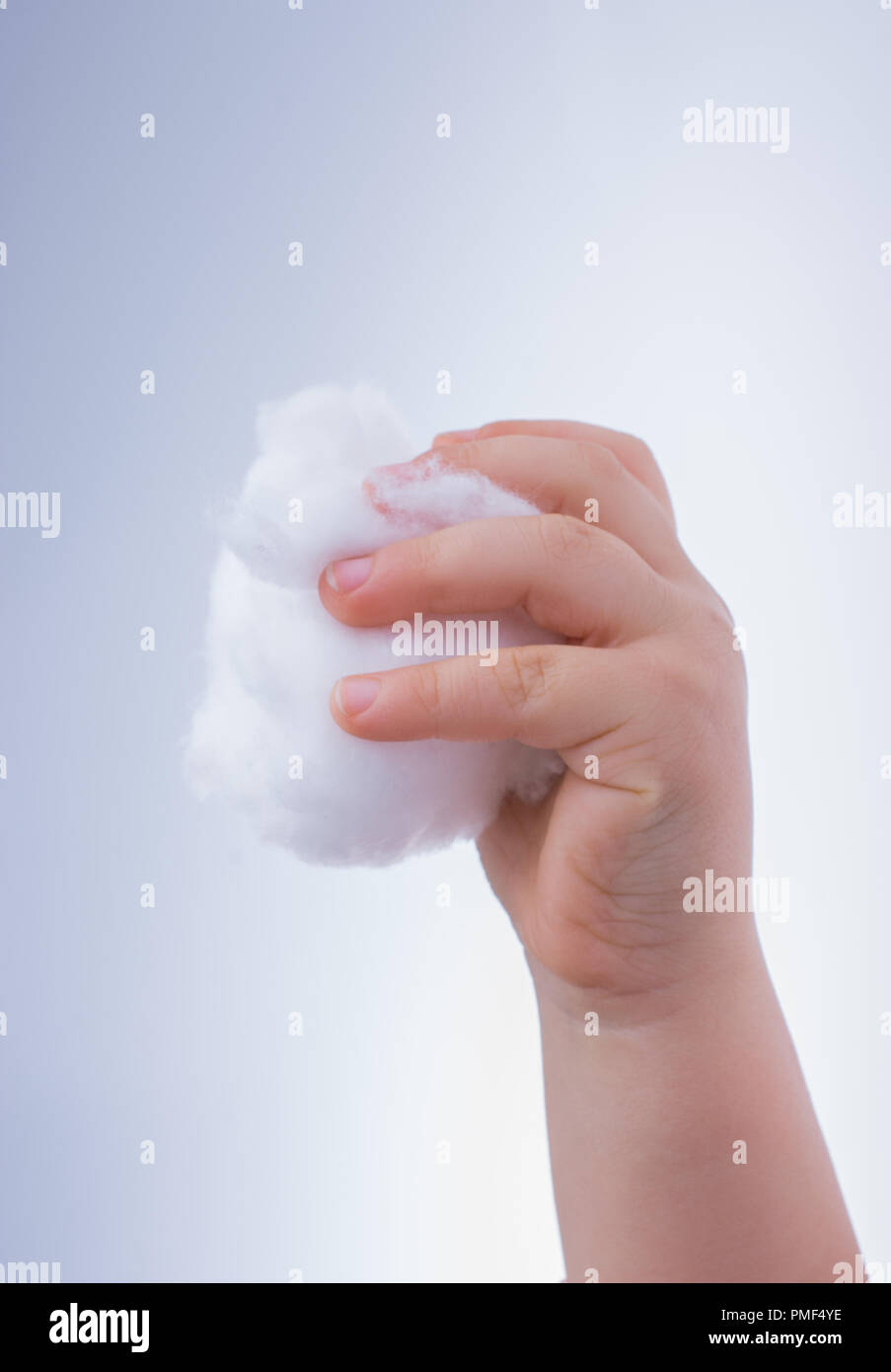 Hand holding some cotton in hand on a white background Stock Photo - Alamy
