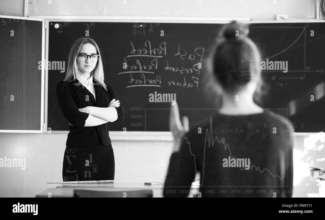 Math teacher in background Black and White Stock Photos & Images - Alamy