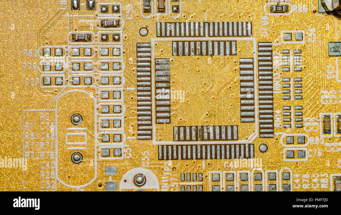 old Electrical circuit board with many conductors close up. electronic ...