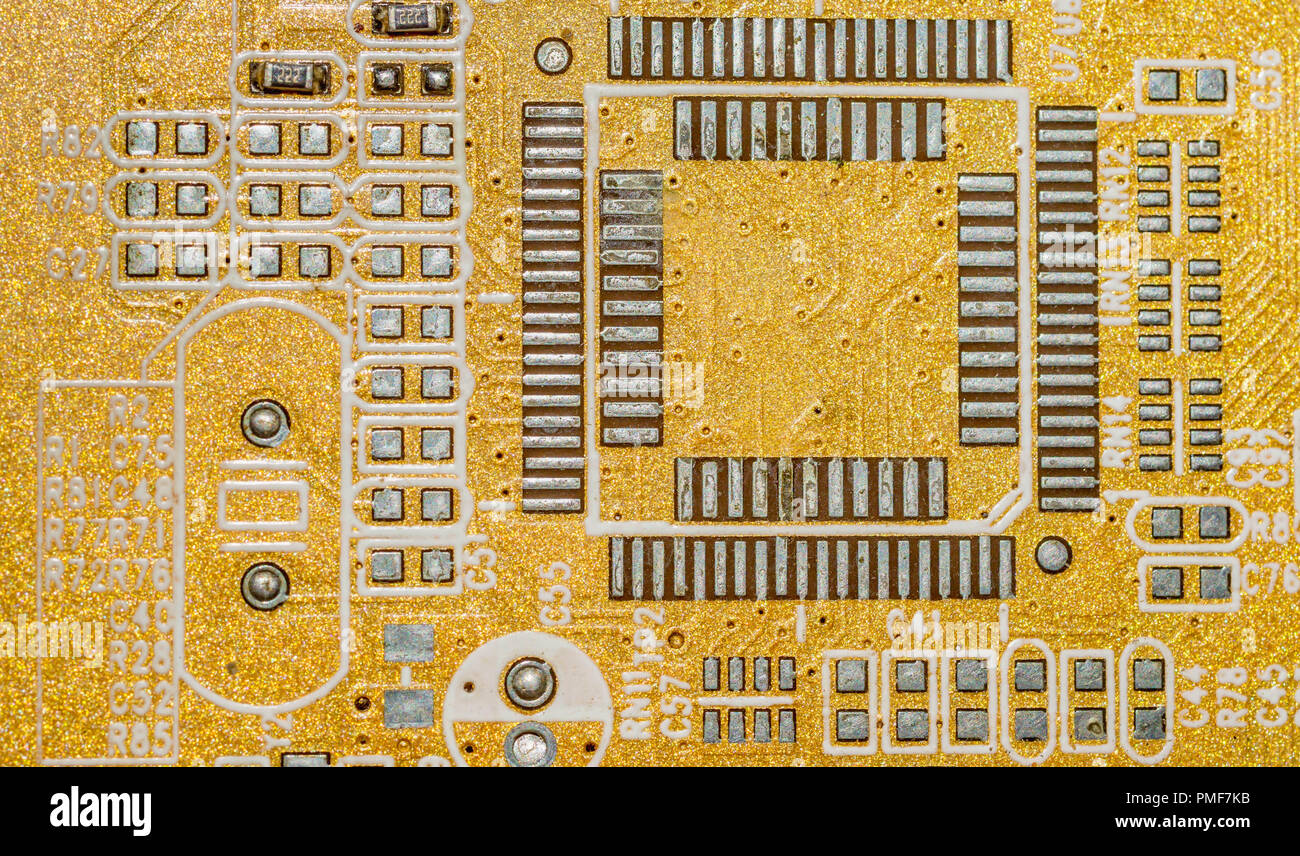 old Electrical circuit board with many conductors close up. electronic ...