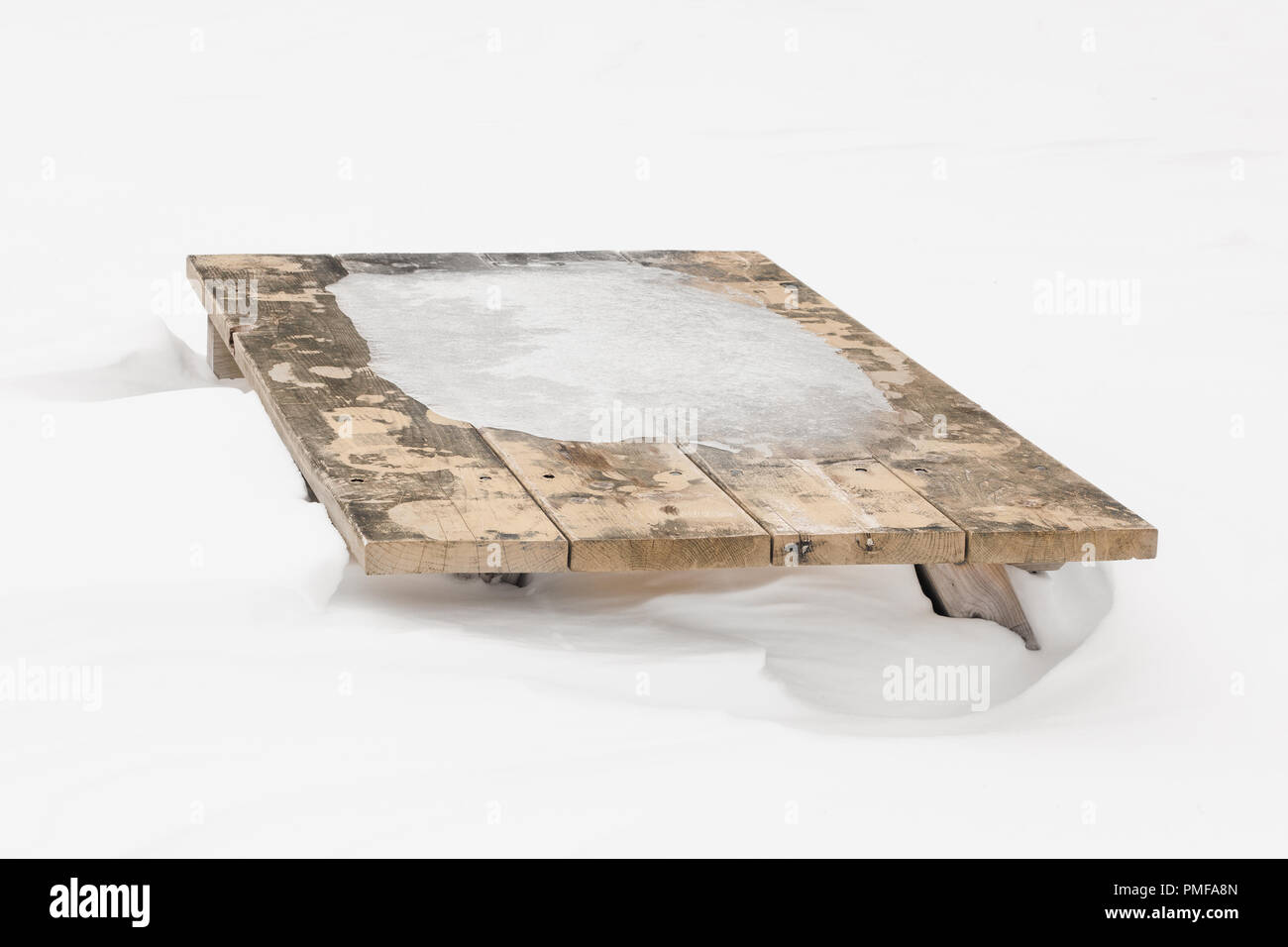 Picnic table frozen in deep snow and ice Stock Photo - Alamy