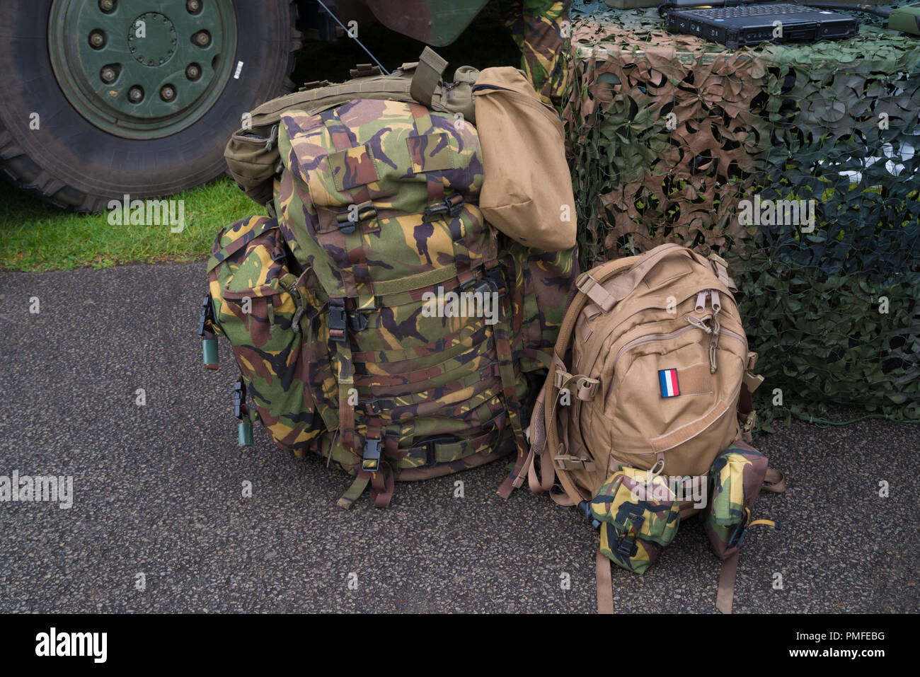 two sizes military backpacks on the ground Stock Photo - Alamy