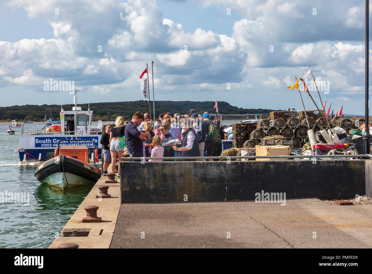 Busy Mudeford Quay as visitors head for the ferry to Hengistbury Head ...
