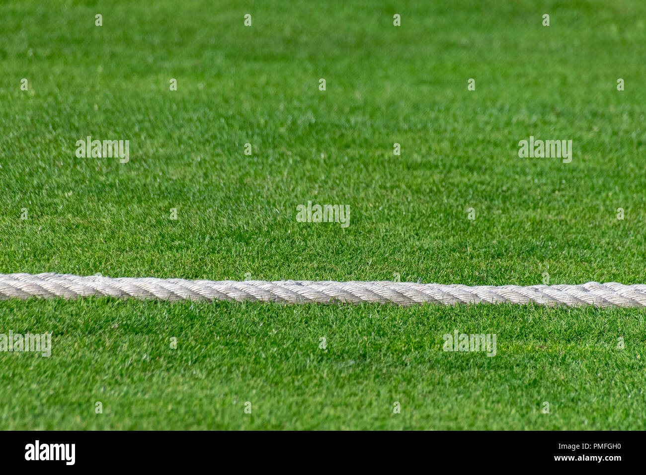 Rope marking the boundary of a rural village cricket pitch Stock Photo ...