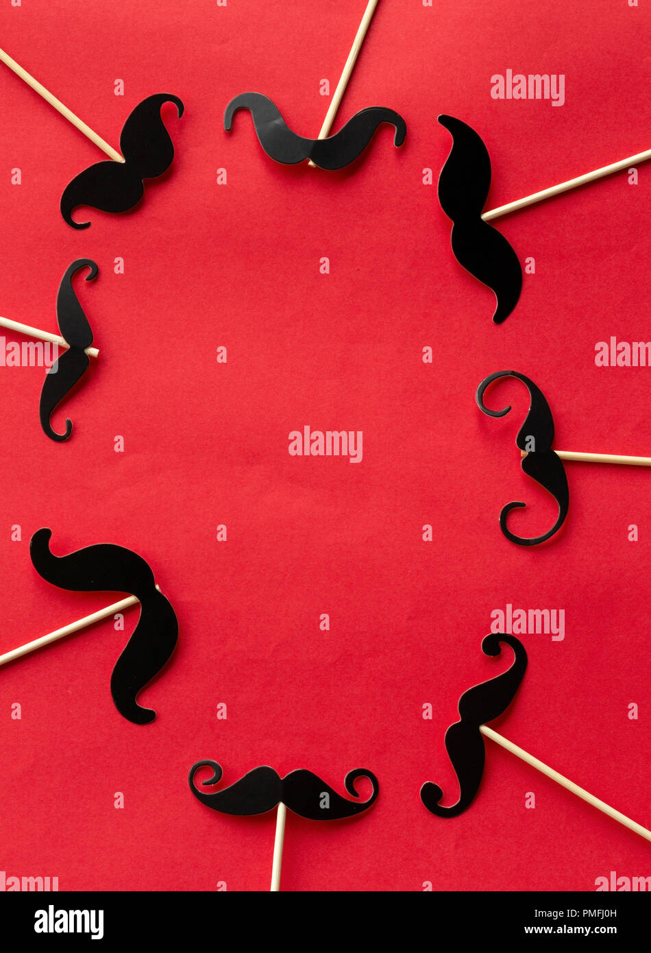 many Paper mustaches on booth props party Stock Photo - Alamy