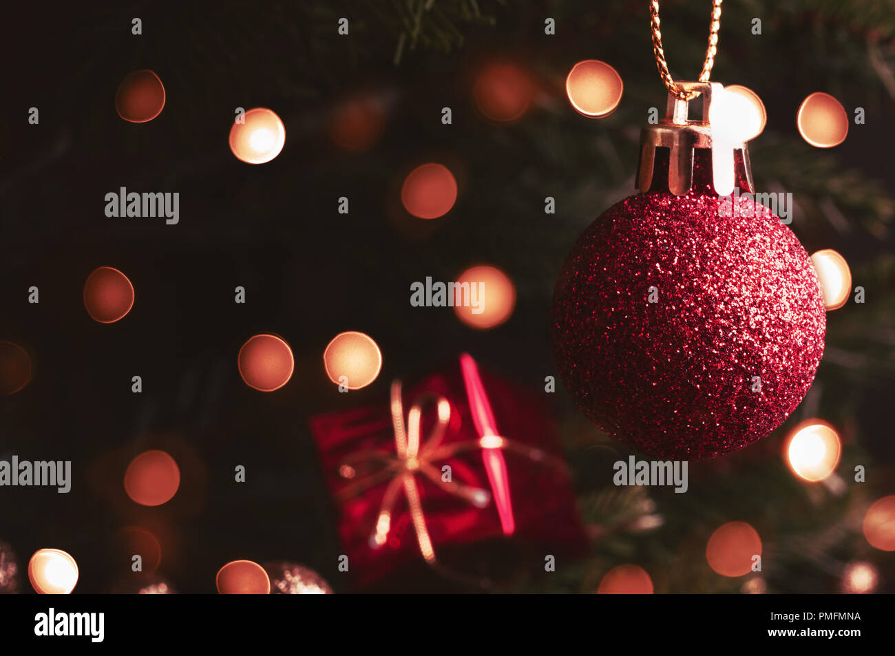 Bauble in tree hi-res stock photography and images - Alamy