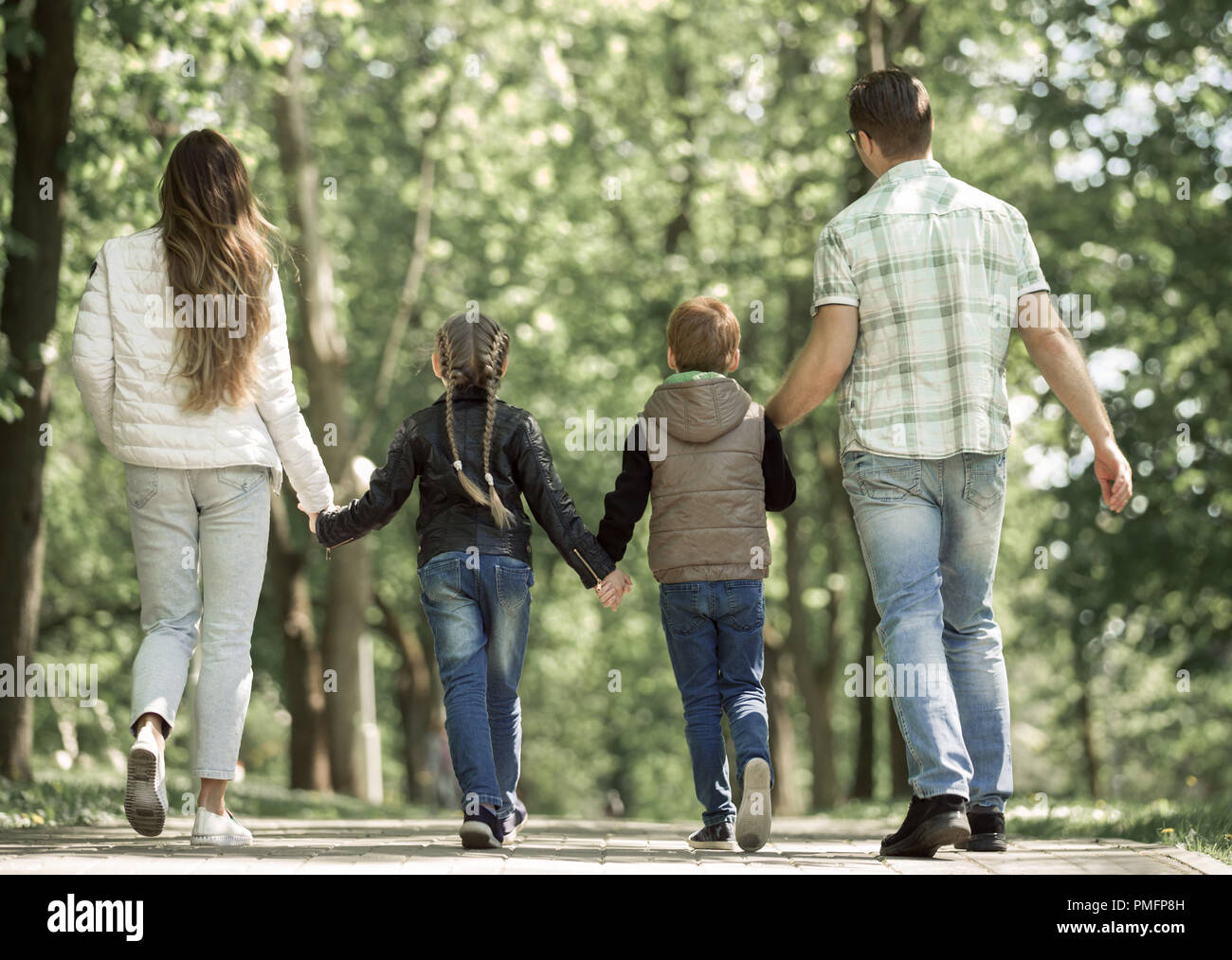 children and parents on a walk in the Park.t Stock Photo - Alamy