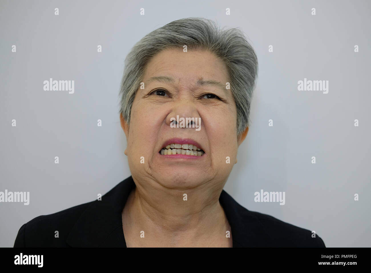 furious elder woman, enraged elderly female. angry asian senior Stock ...