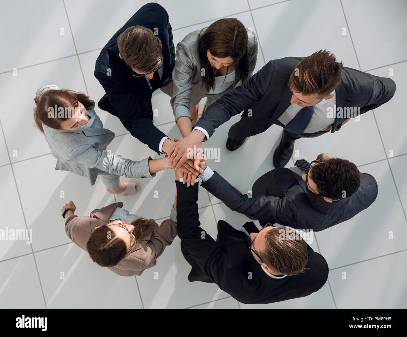 top view.a group of employees standing in a circle Stock Photo - Alamy