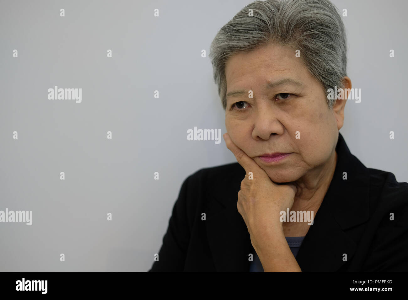 old woman thinking. thoughtful pensive senior on white background Stock ...