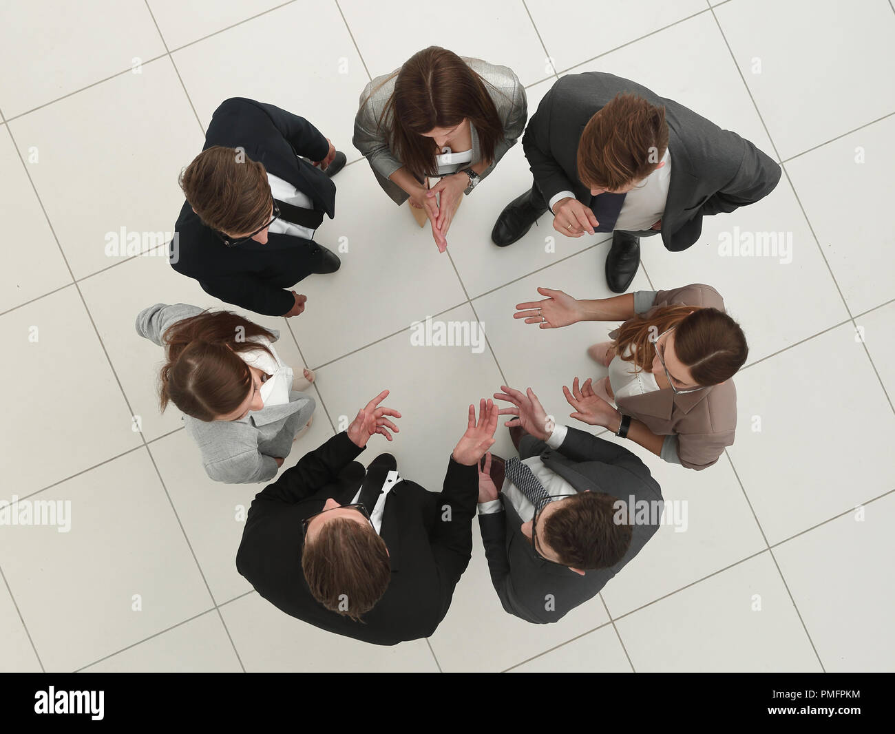 top view.business team discussing something standing in a circle Stock ...