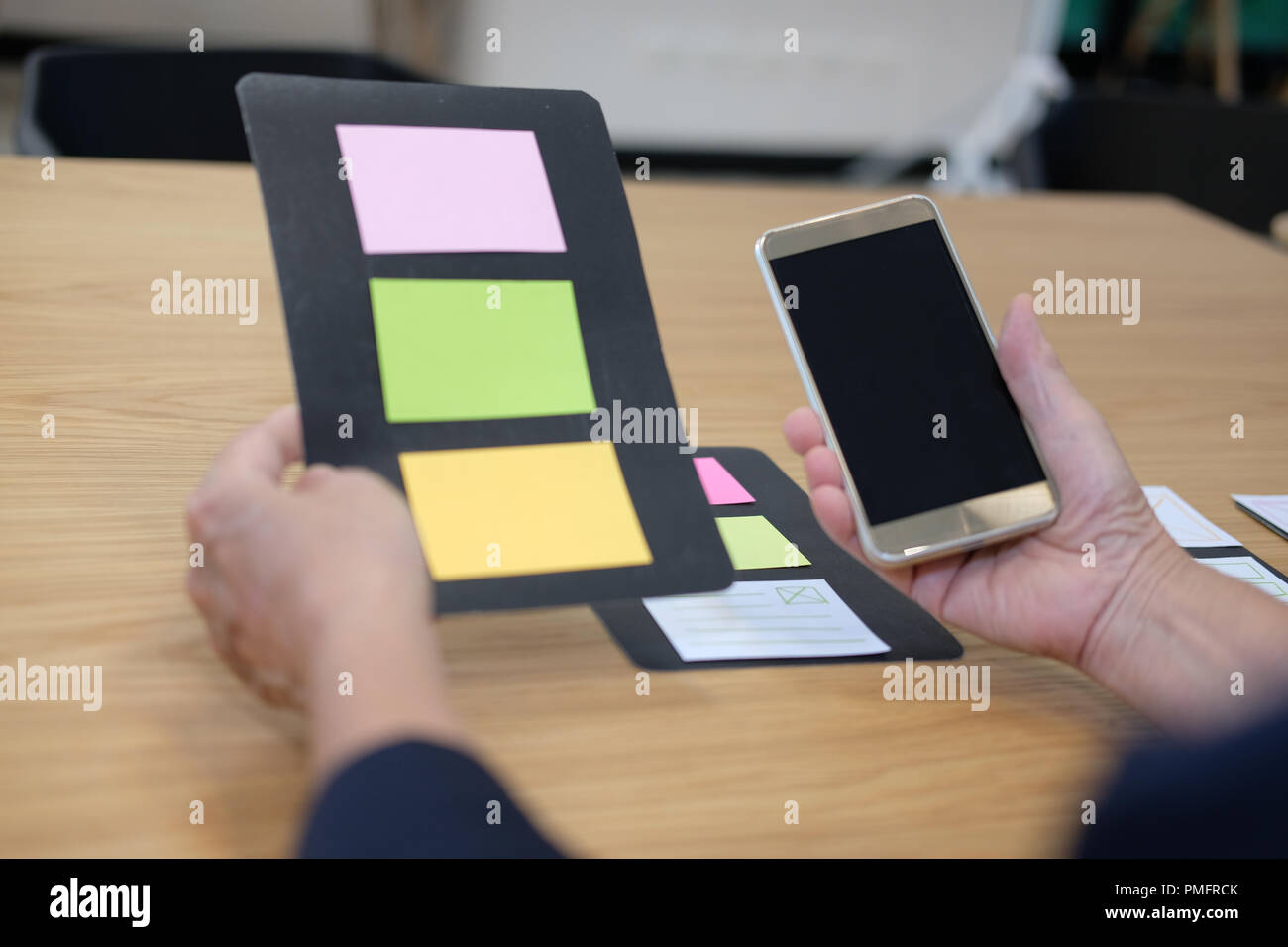 user experience (UX) designer designing web on smart phone layout. UI ...