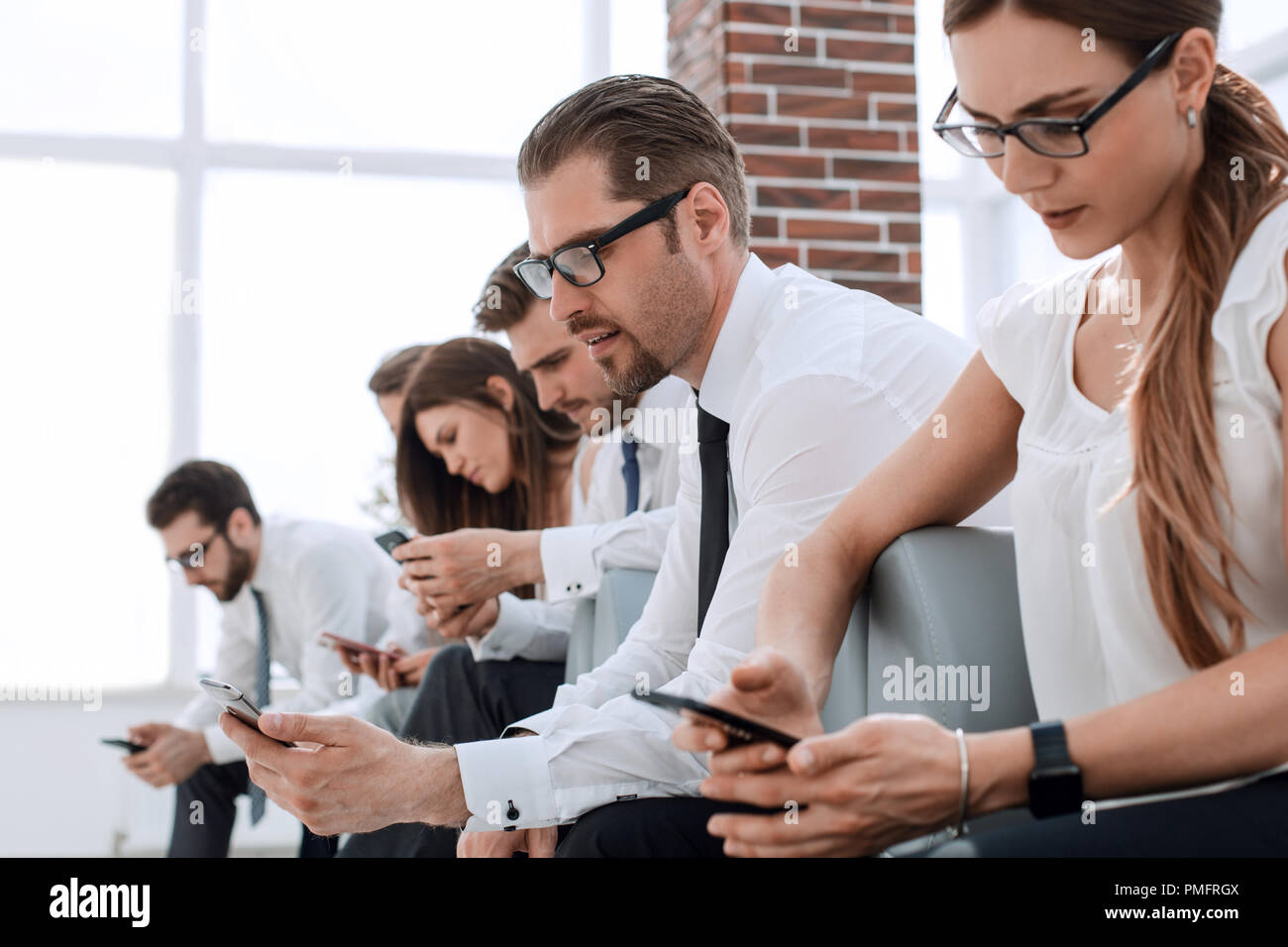 young woman sitting in line for an interview Stock Photo - Alamy