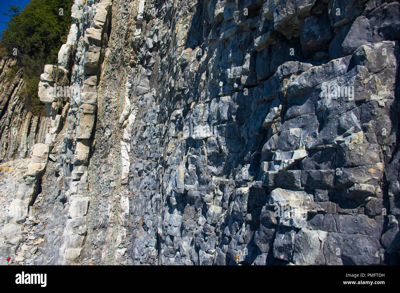 rock formations and stones of the sea coast, weathered and smoothed by ...