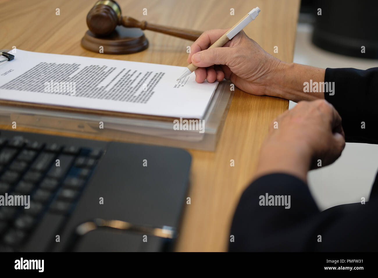 businesswoman sign contract. lawyer with agreement document at law firm ...