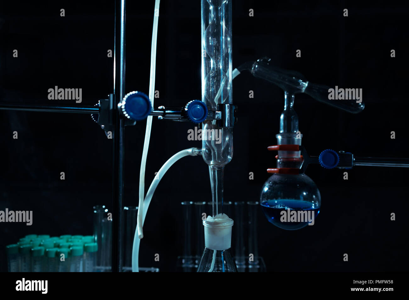 Laboratory glassware over black background Stock Photo - Alamy