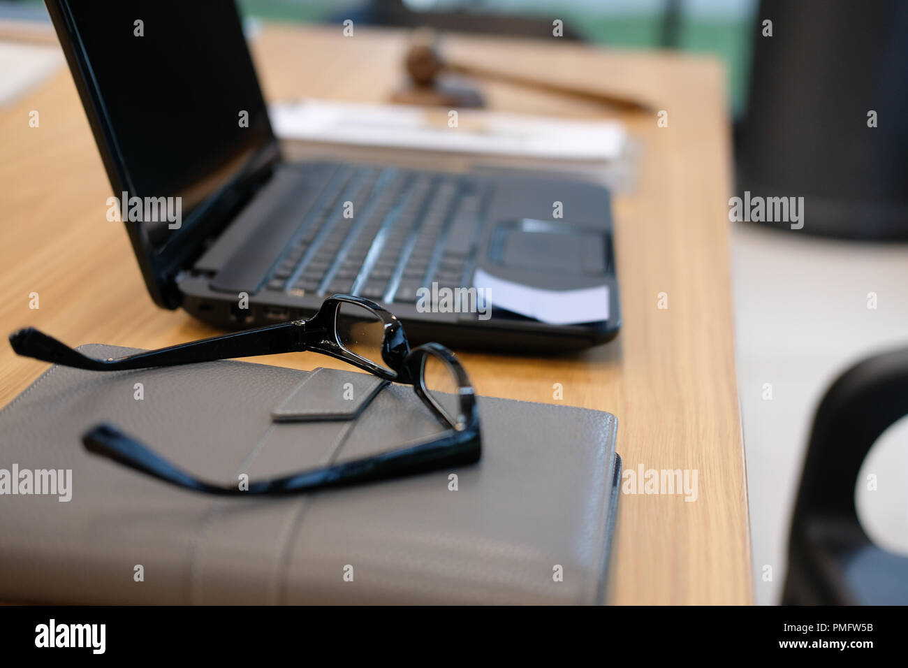 eyeglasses computer laptop on wood office desk near window. wokring ...