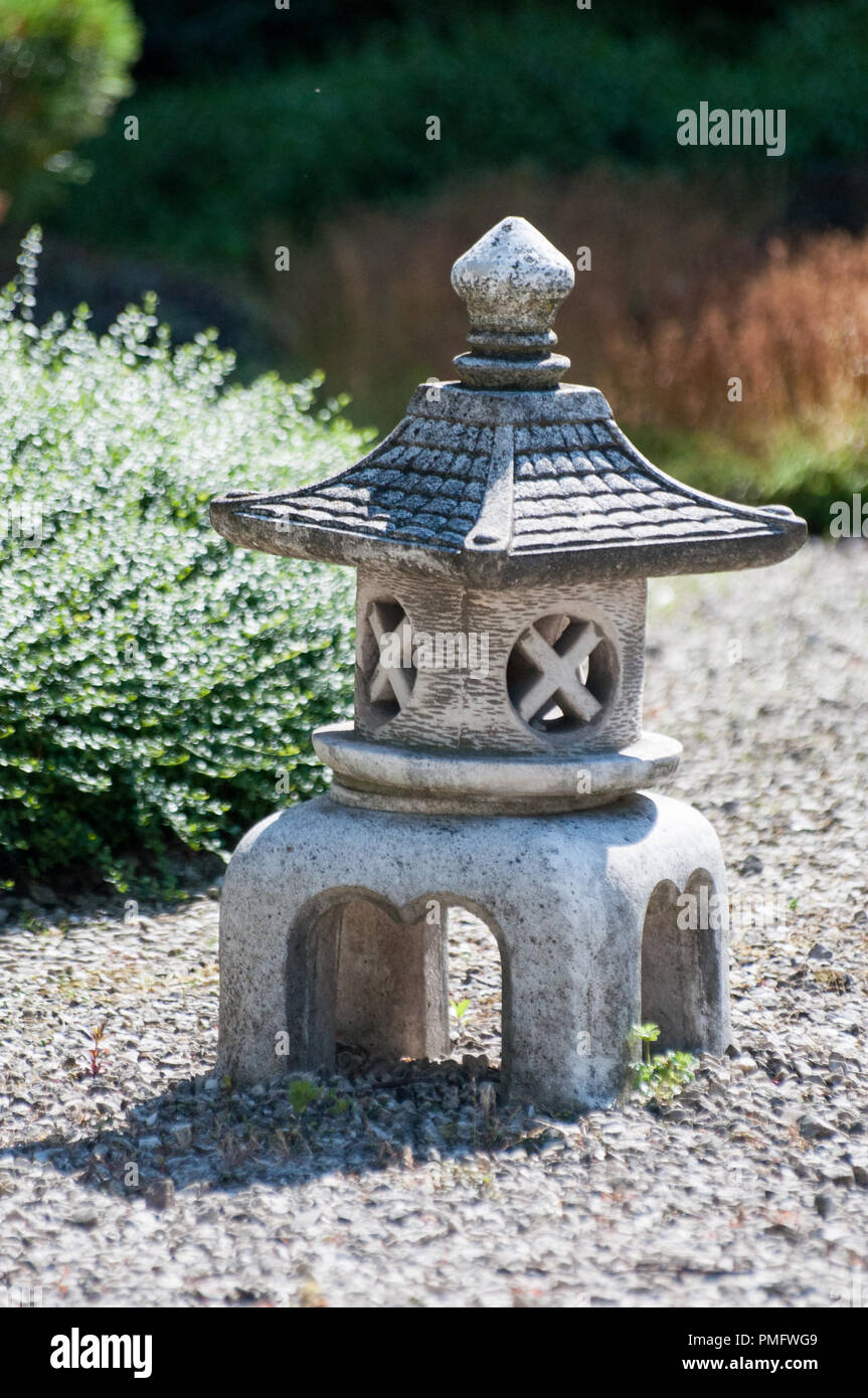 Small statuette resembling tower made of stone Stock Photo - Alamy
