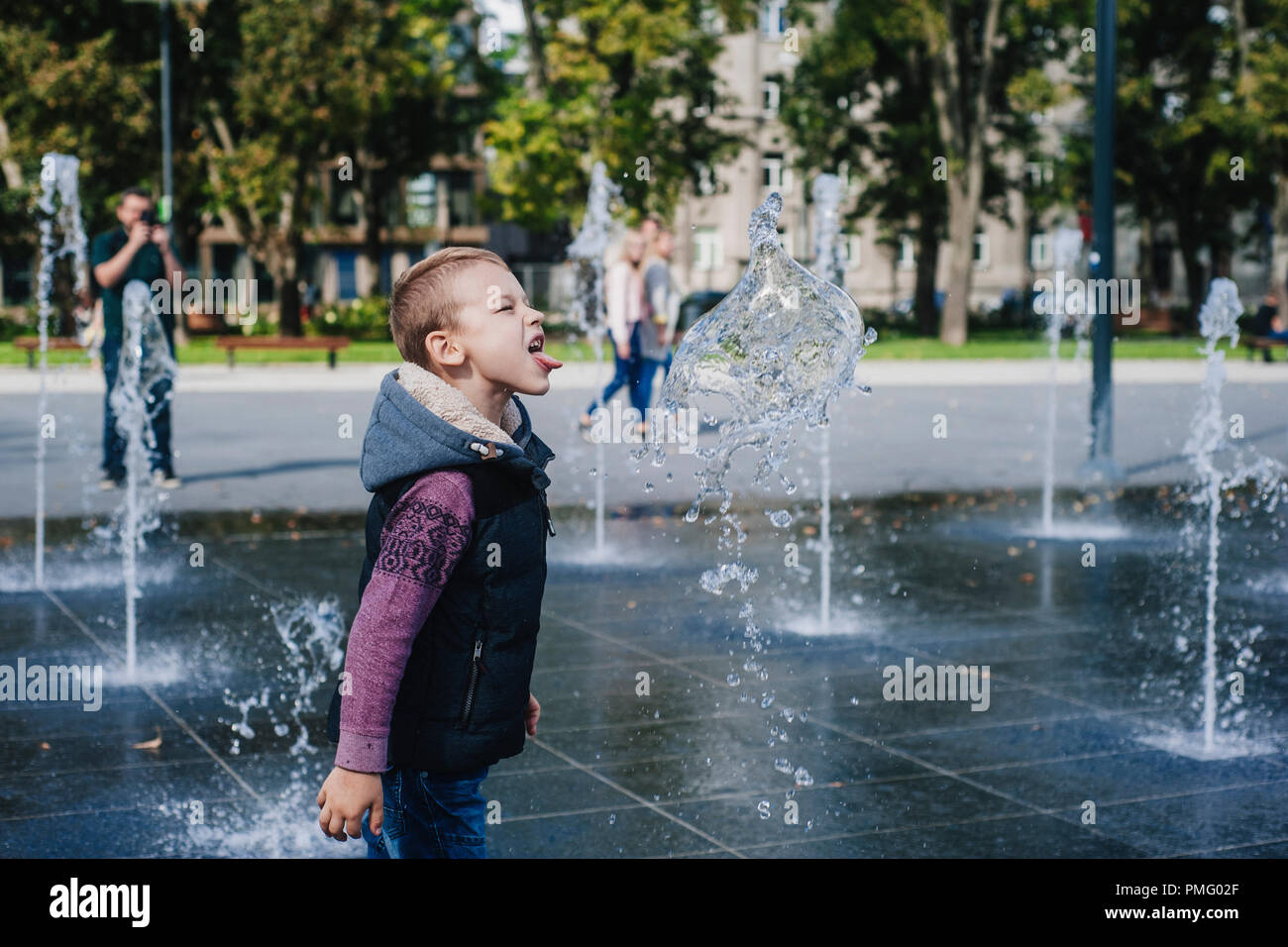 Happy healthy kids playing in the water hi-res stock photography and ...