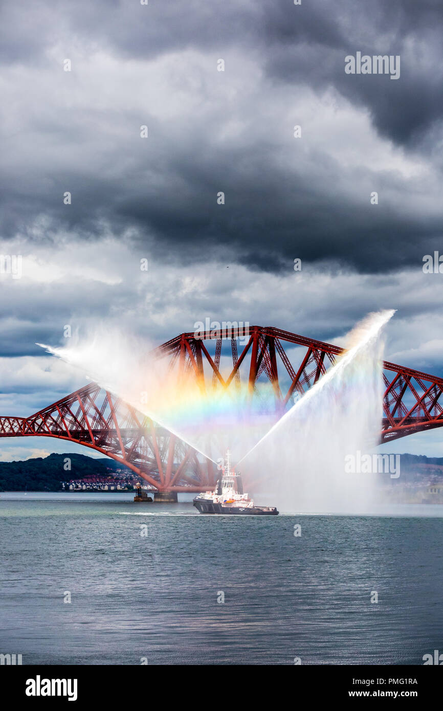 Tug boat using water cannon at Forth Bridge Stock Photo - Alamy