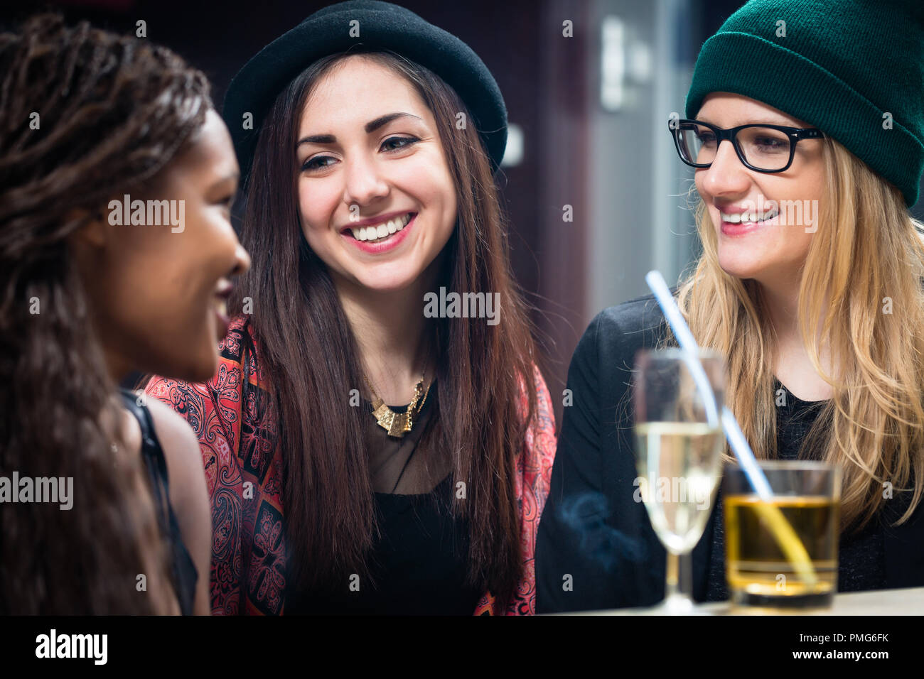 Smiling teenage friends at the restaurant Stock Photo - Alamy