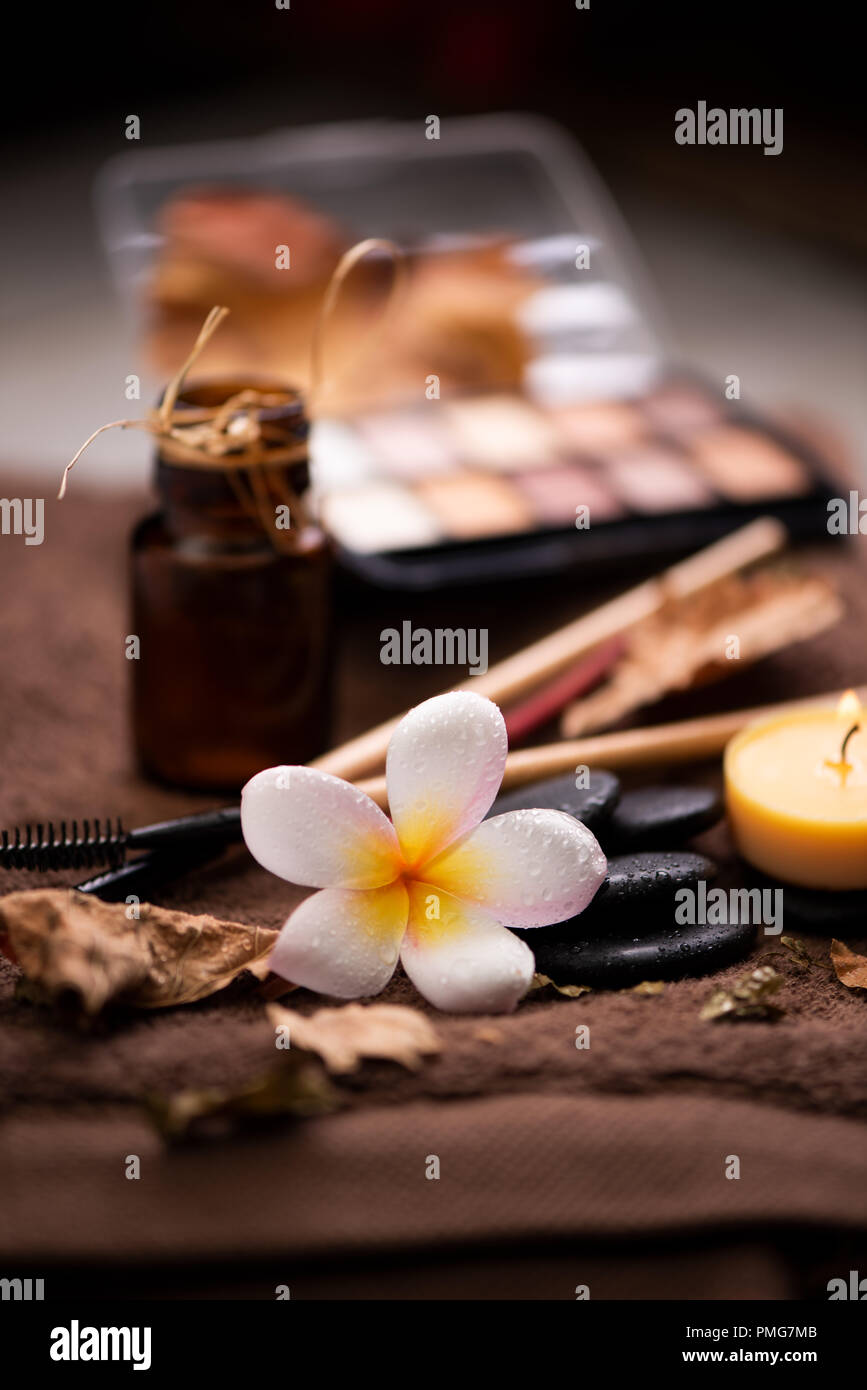 spa setting wirh make up on towel Stock Photo - Alamy