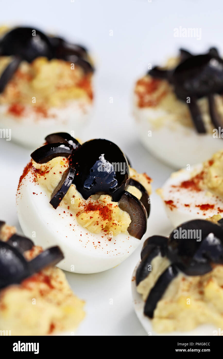 Fun food for kids. Halloween boiled eggs with black olive spiders on ...
