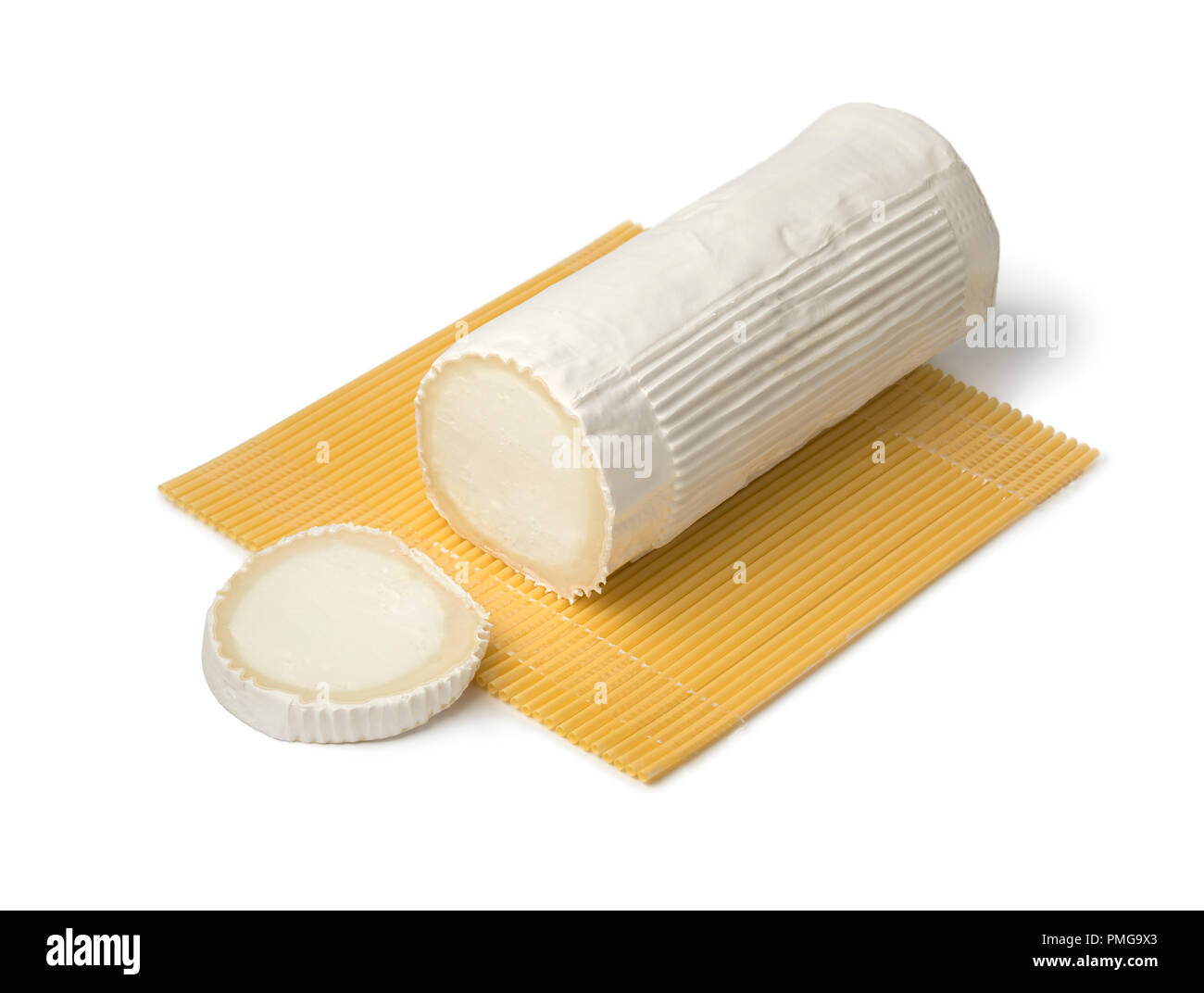 Roll of soft white organic goat cheese and slice isolated on white ...