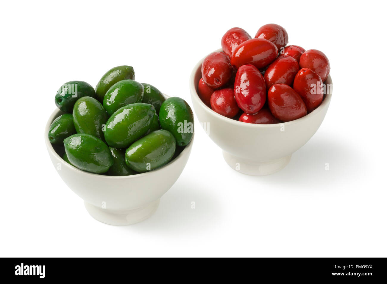 Bowls with red and green Italian Bella olives isolated on white ...