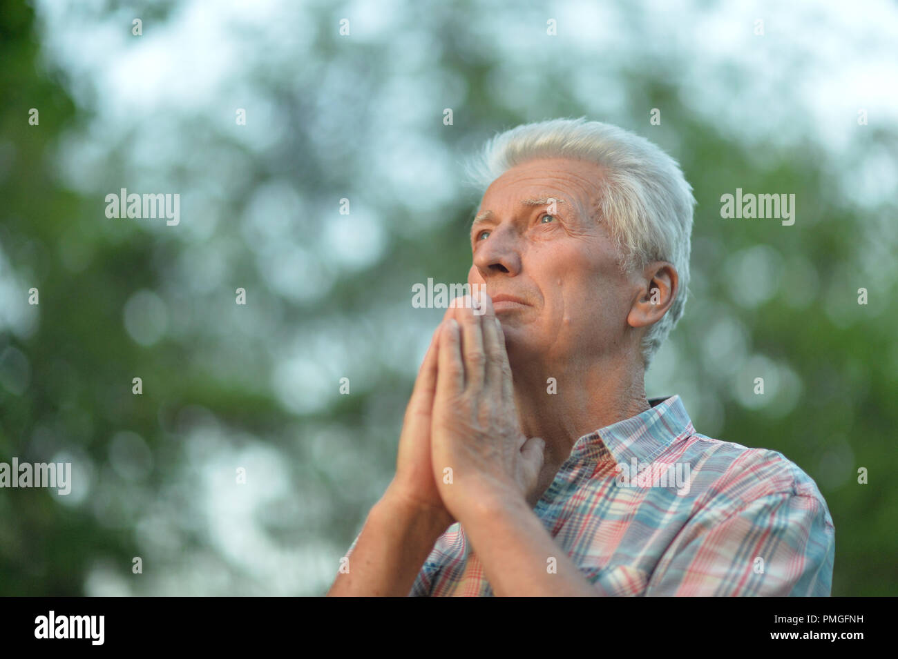 Praying the park hi-res stock photography and images - Alamy