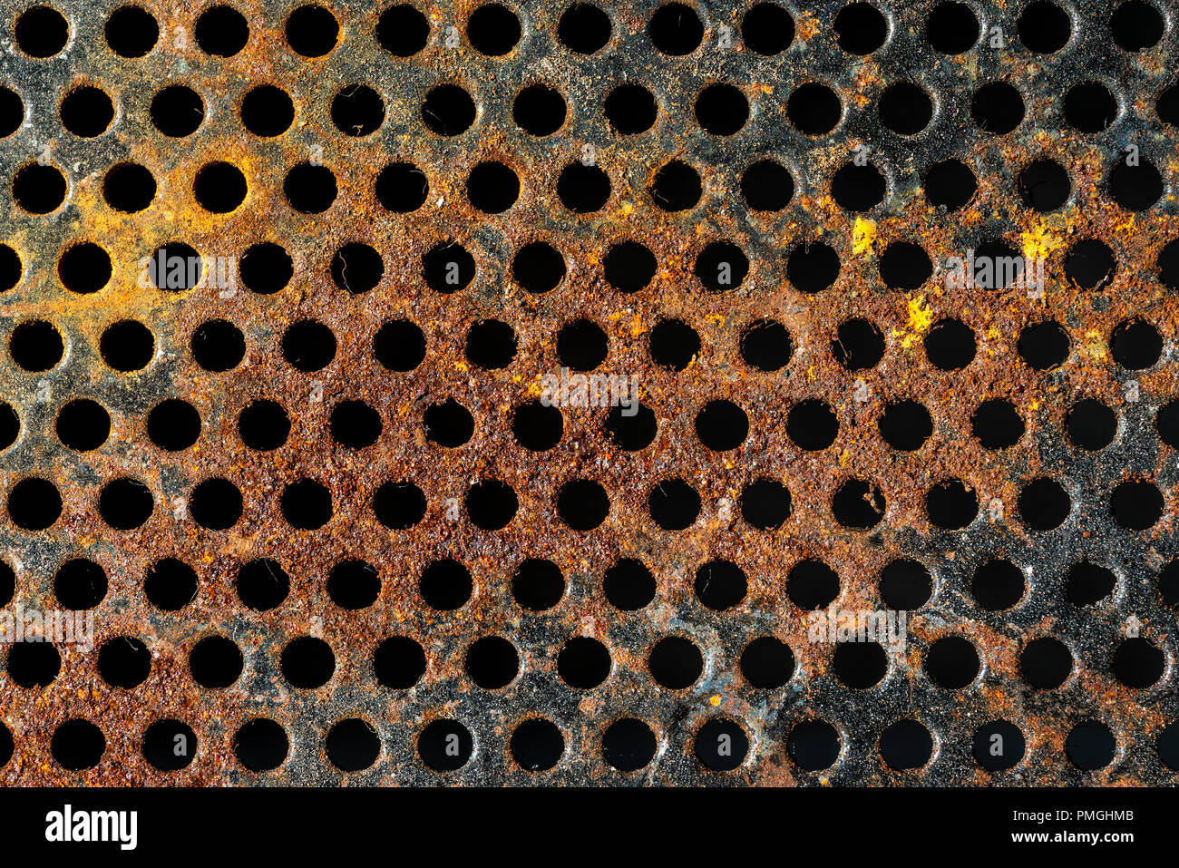 rusty and perforated metal background that occupies the entire cuador ...