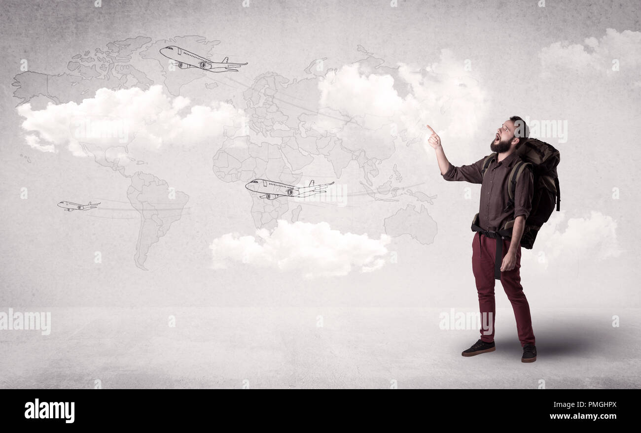 Handsome young man standing with a backpack on his back and planes in ...