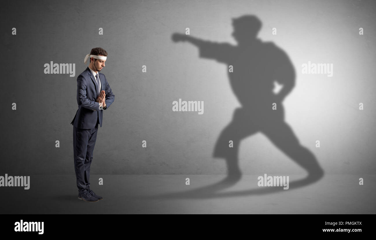 Young karate man confronting with his own shadow Stock Photo - Alamy