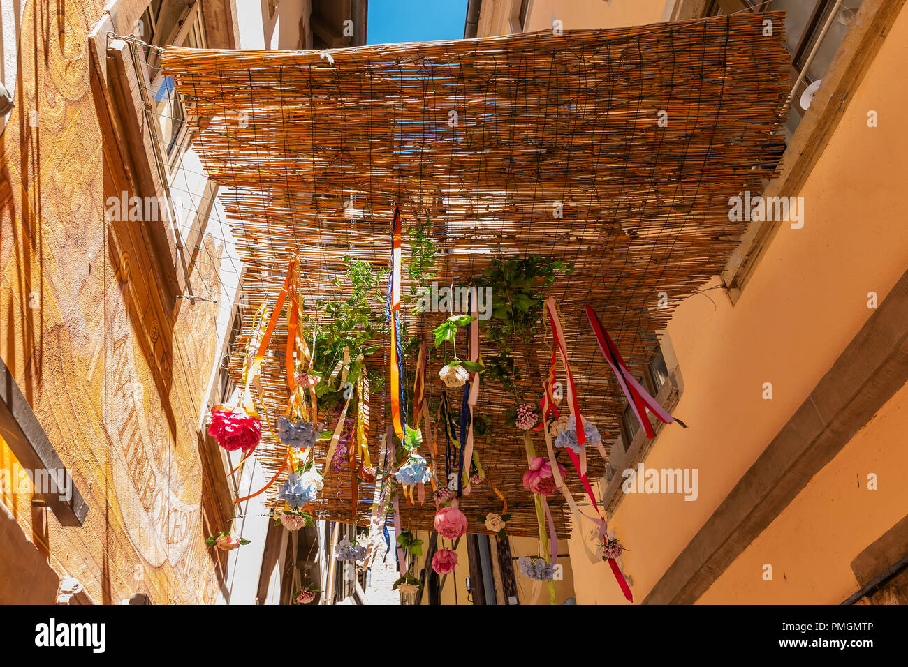 sun shade with hanging flowers in an alley in Strasbourg France Stock ...