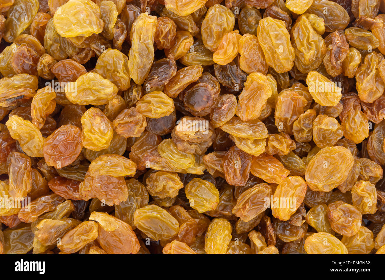Top close view of a portion of golden raisins Stock Photo - Alamy