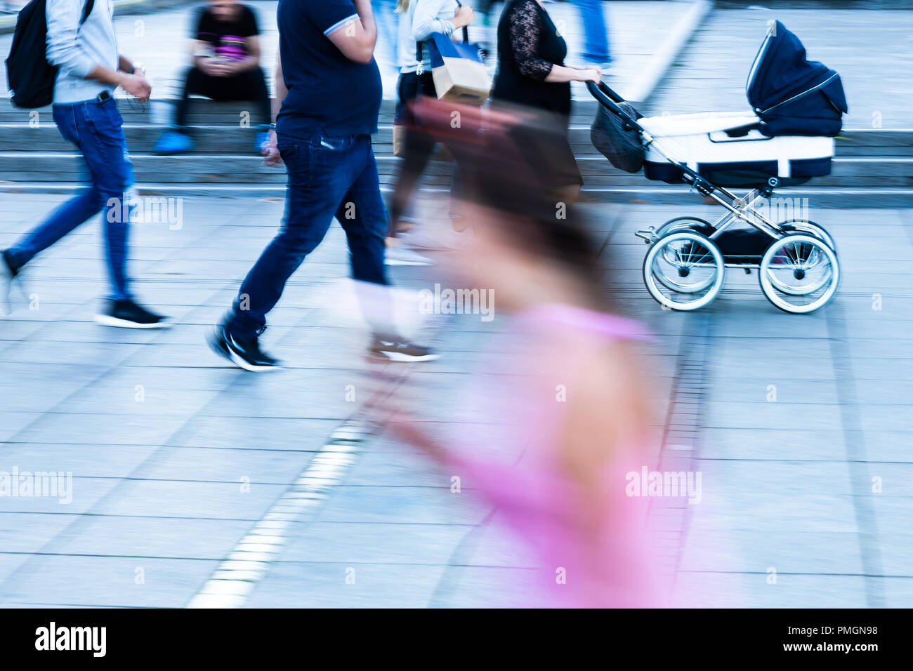 picture with camera made motion blur of people walking in the city ...