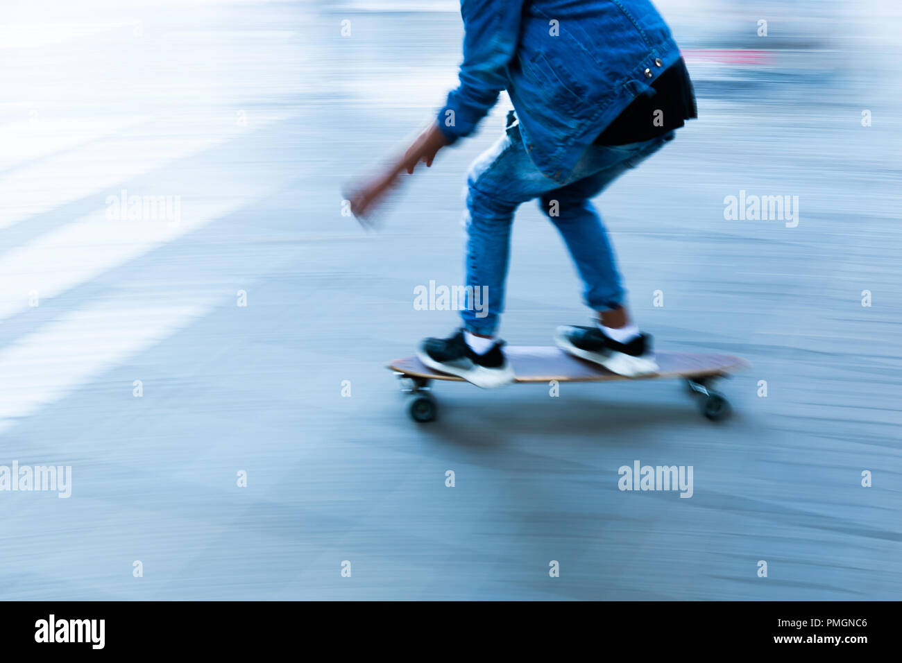 boy on a skateboard in camera made motion blur Stock Photo - Alamy