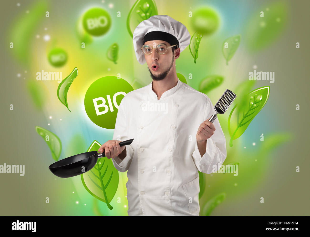 Green bio leaves concept and cook portrait with kitchen tools Stock ...