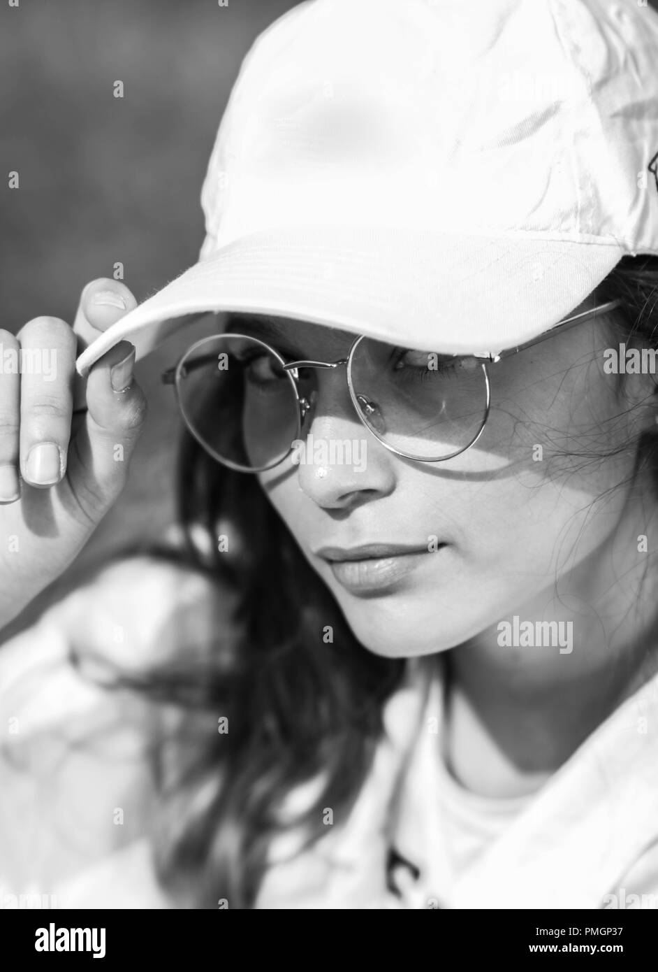Black white portrait of a young beautiful brunette woman with rounded ...
