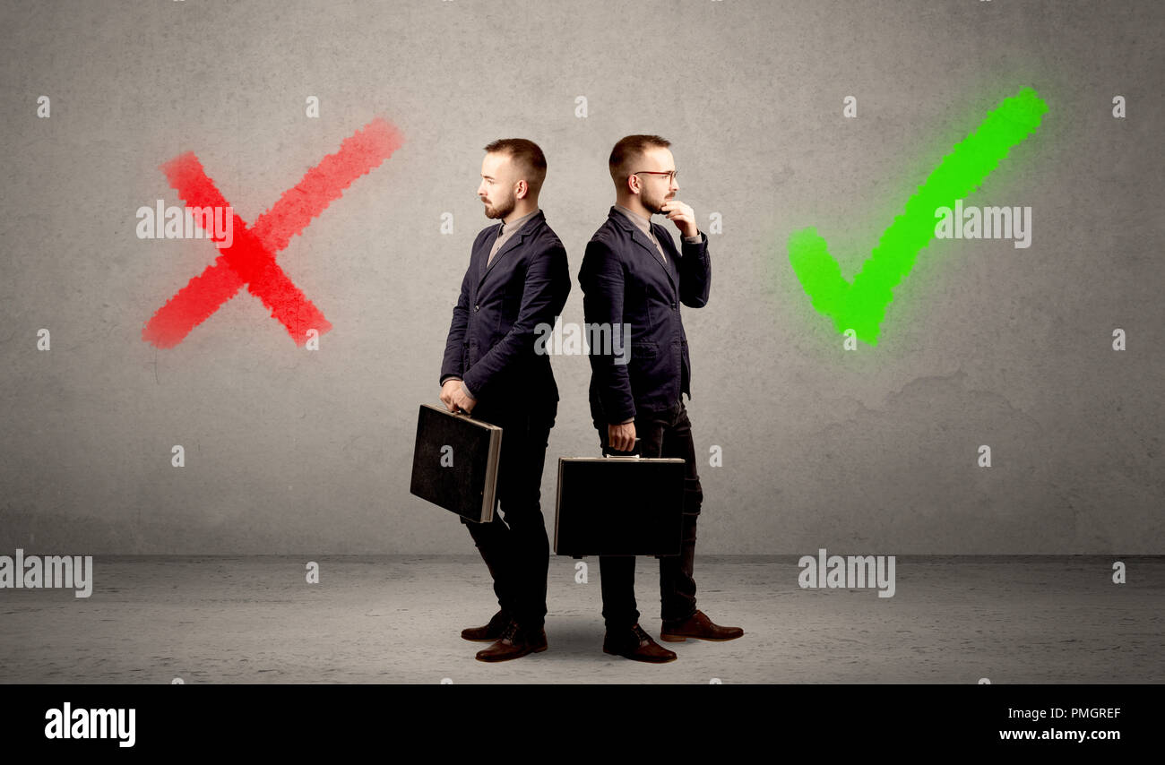 Young conflicted businessman choosing between a right and a wrong ...