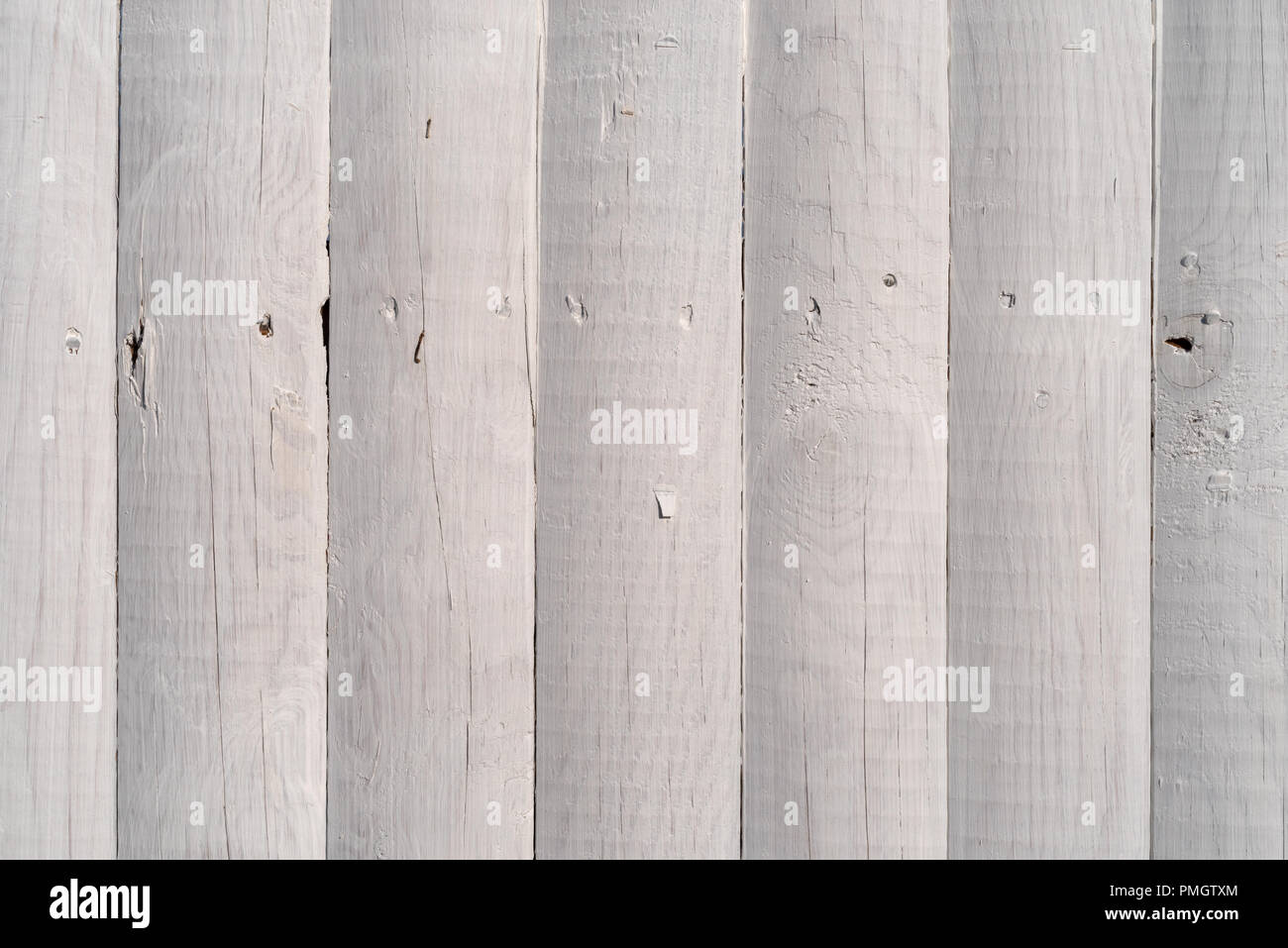 Close view of whitewashed cedar hewn log fencing Stock Photo - Alamy