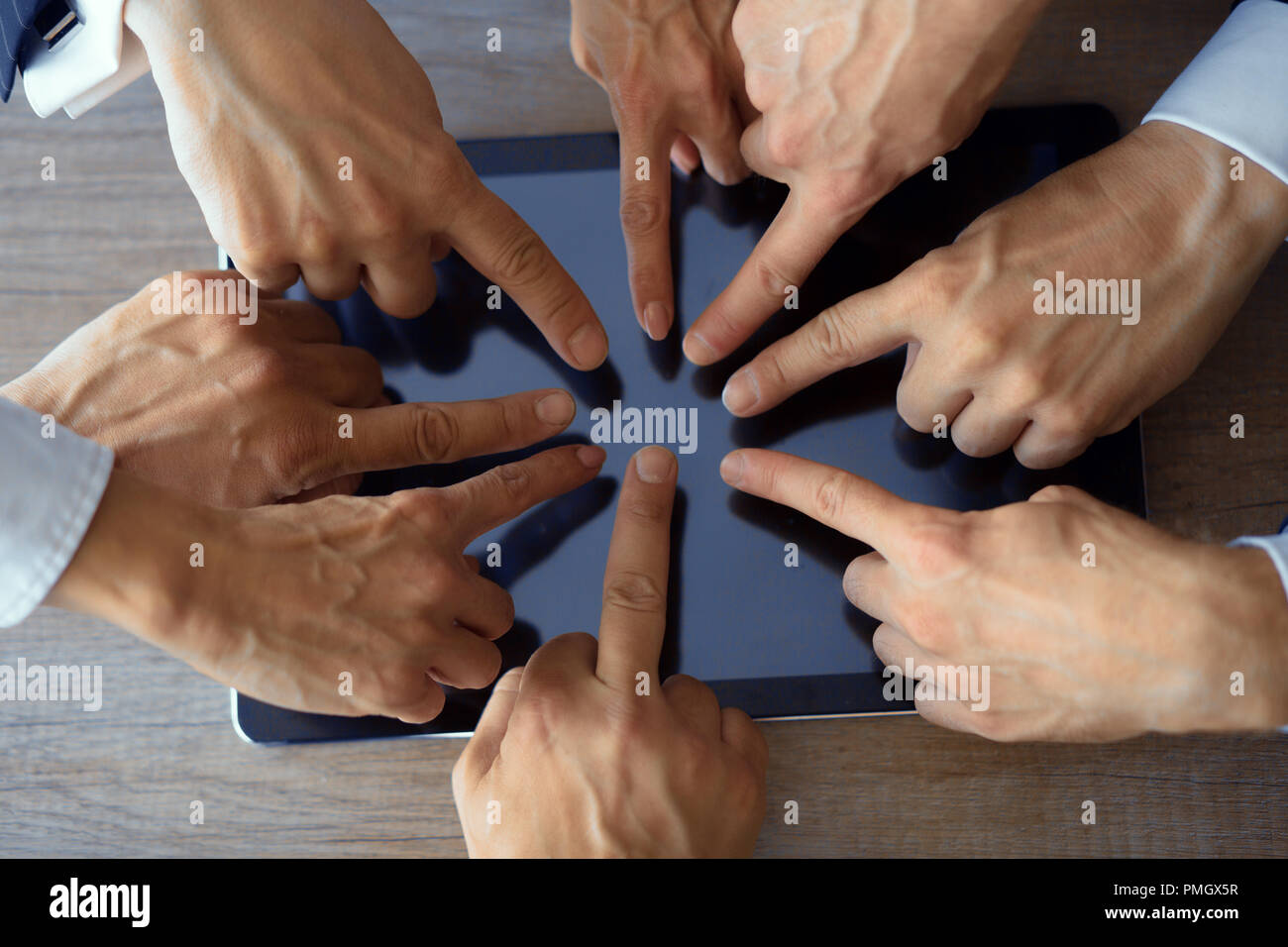 Hand touching tablet in office Stock Photo - Alamy