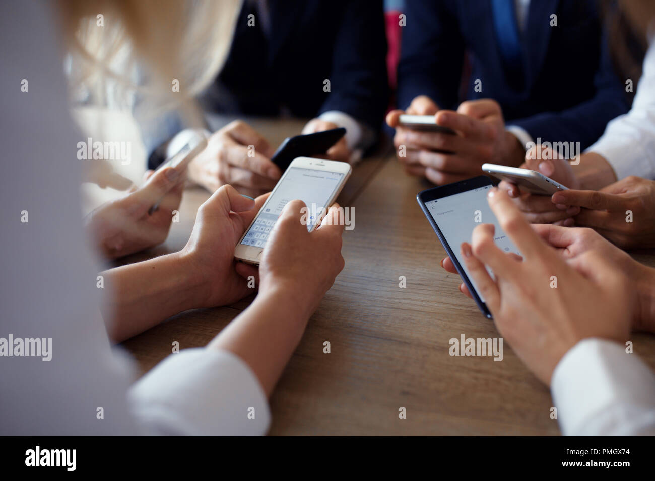 Using smartphones man woman hi-res stock photography and images - Alamy