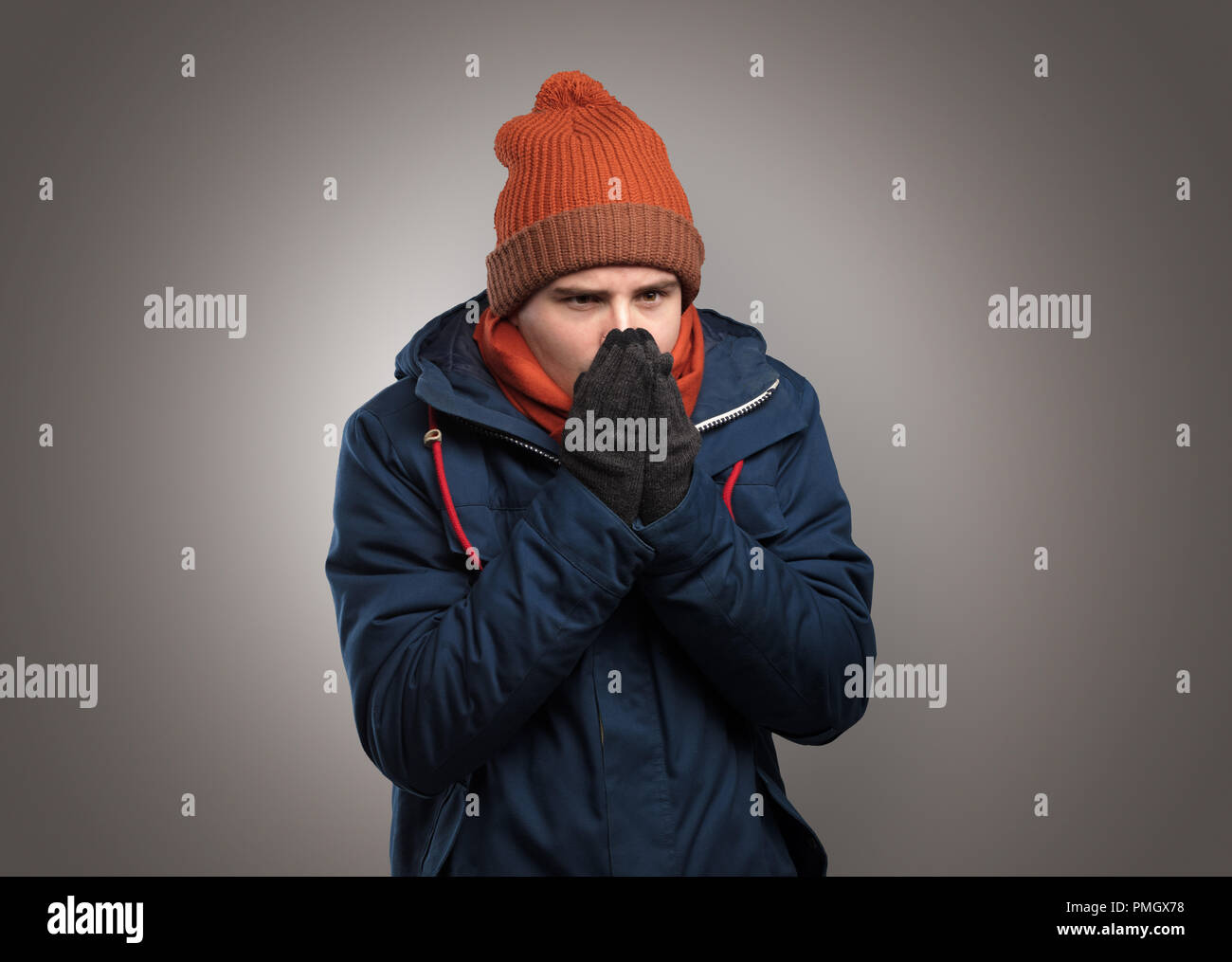 Handsome young boy freezing in warm clothing with copy space Stock ...
