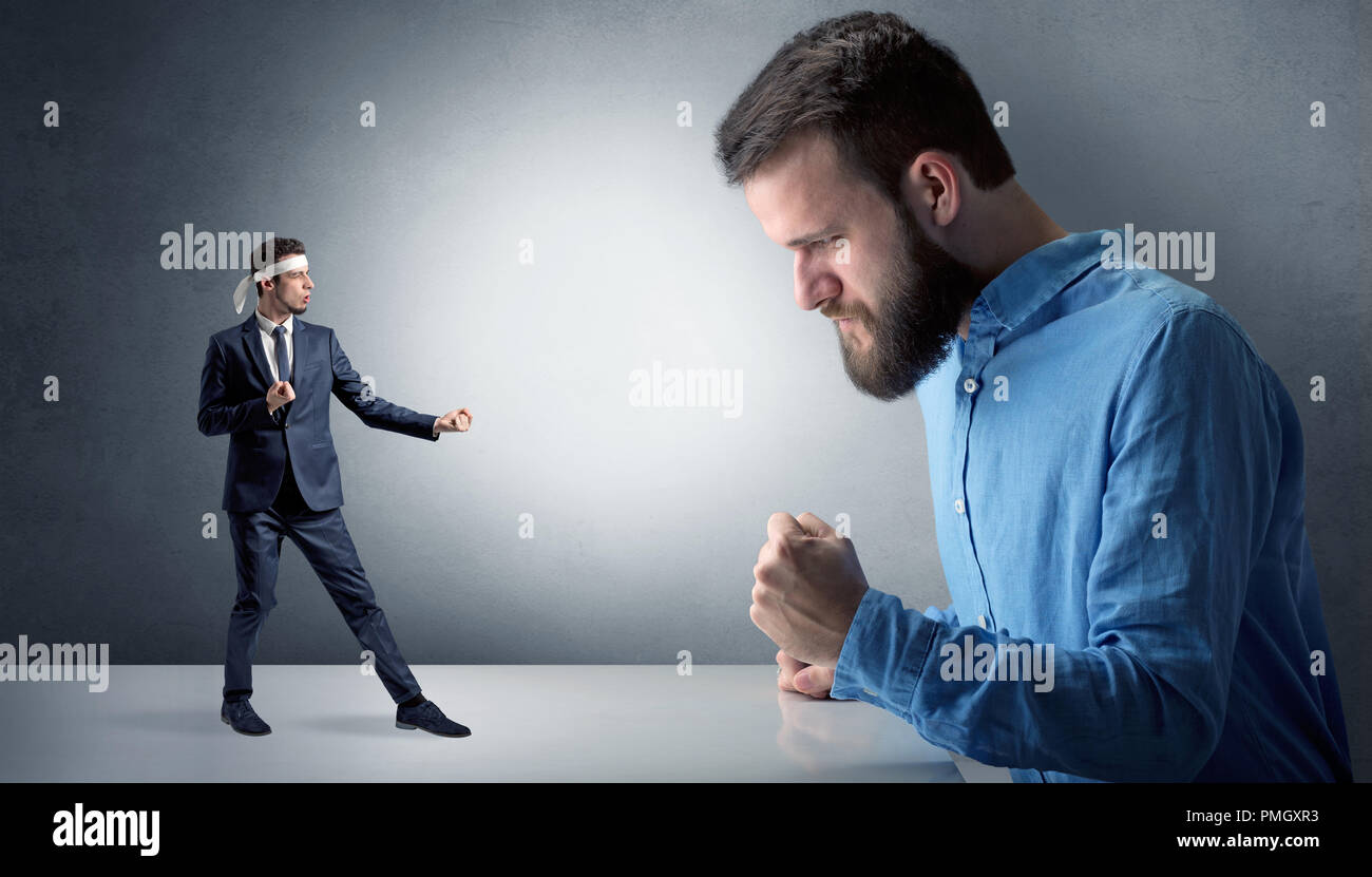 Giant hipster man yelling at a small karate man Stock Photo - Alamy