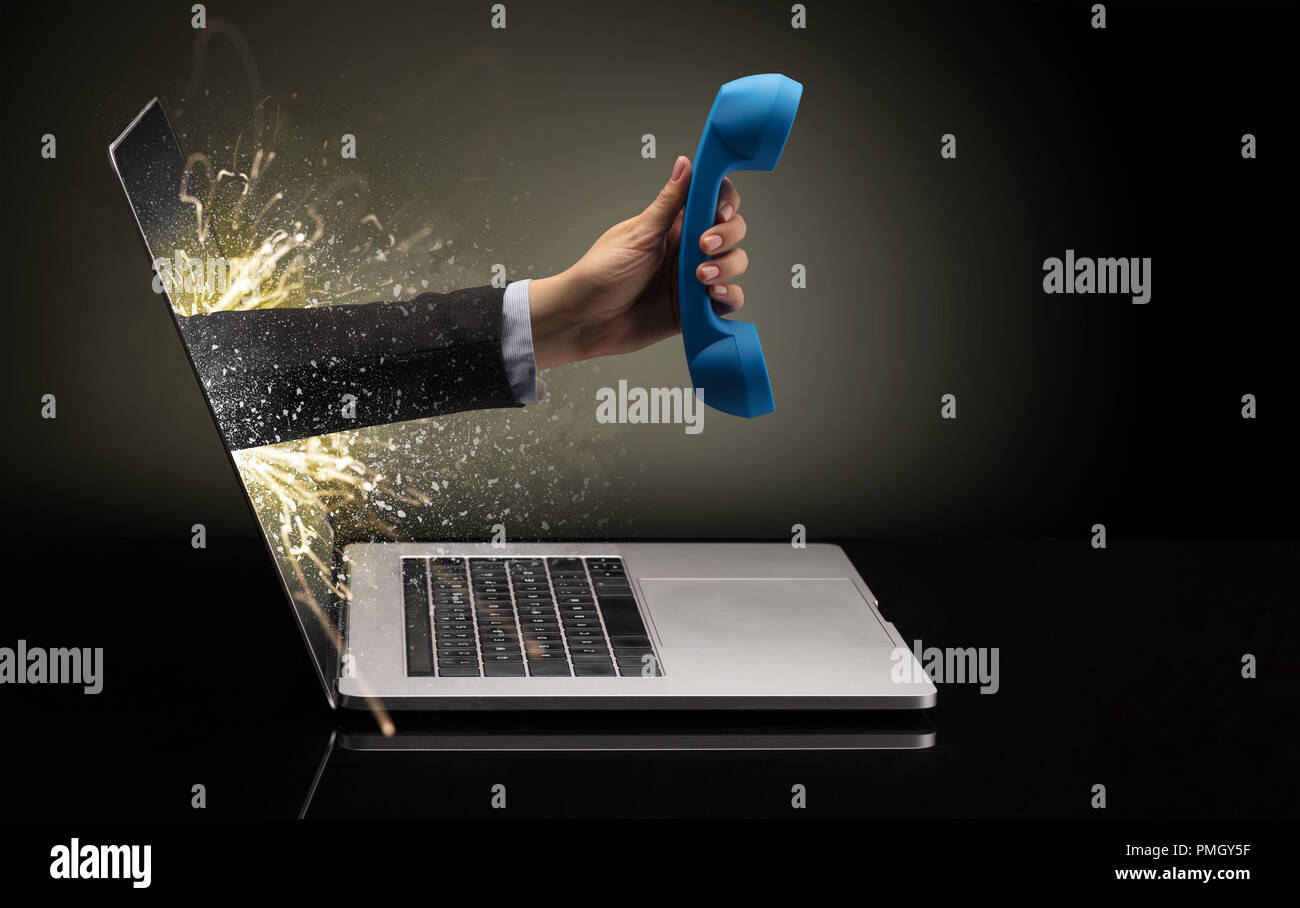 Hand with phone coming out of a laptop with sparkling effects Stock ...